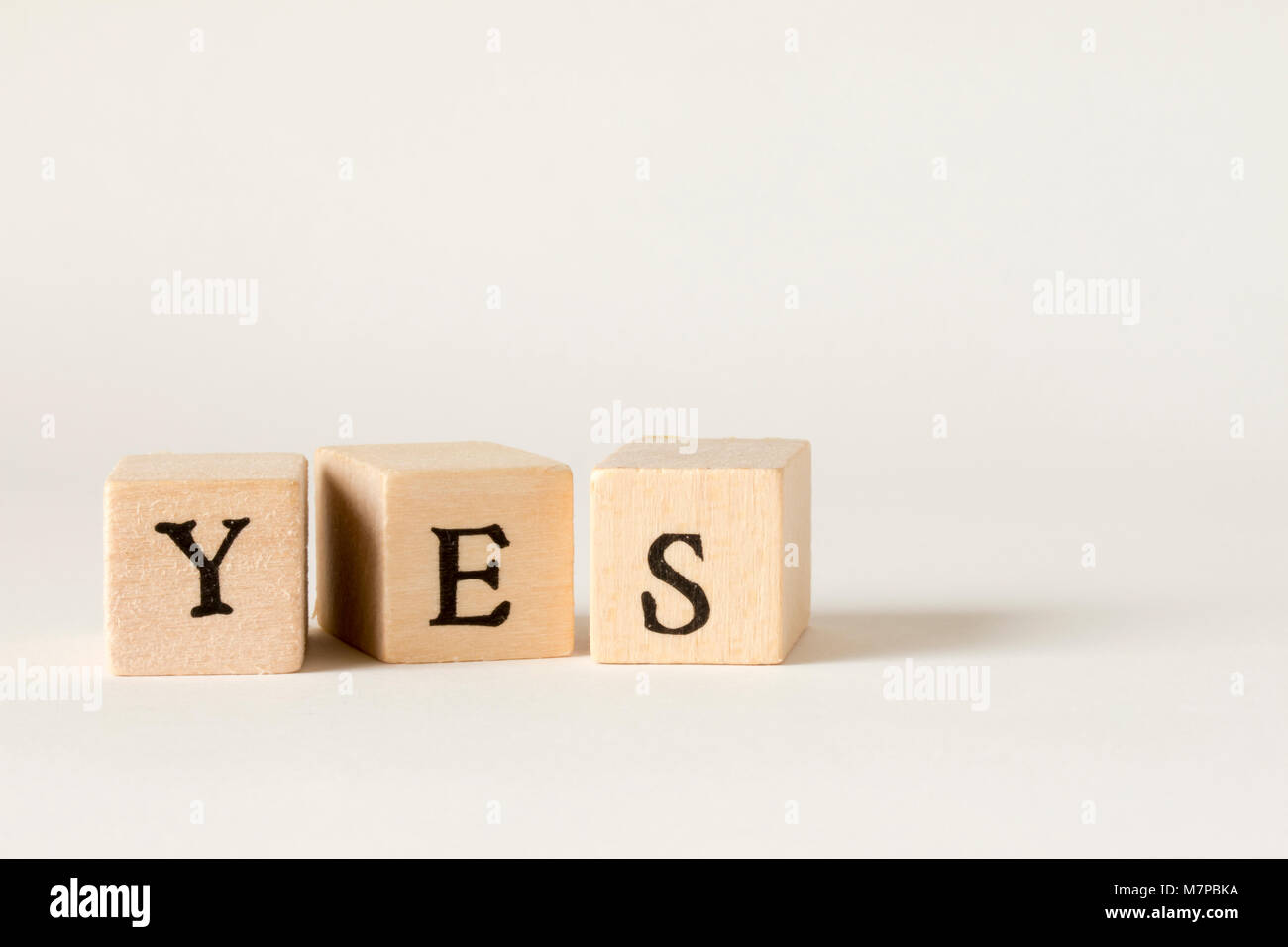 YES word made with building blocks - Sign of acceptance Stock Photo - Alamy