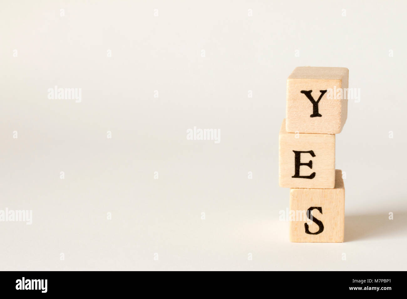 YES word made with building blocks - Sign of acceptance Stock Photo - Alamy