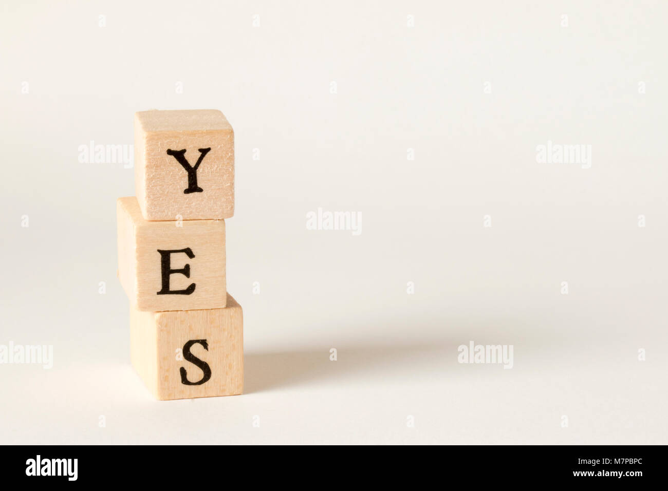 YES word made with building blocks - Sign of acceptance Stock Photo - Alamy