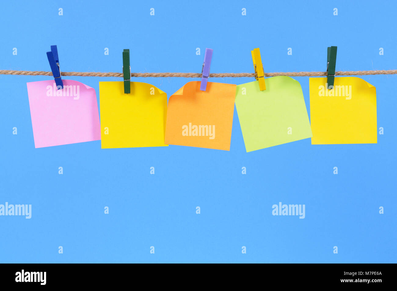 Blank office sticky notes hanging on a rope or washing line Stock Photo ...