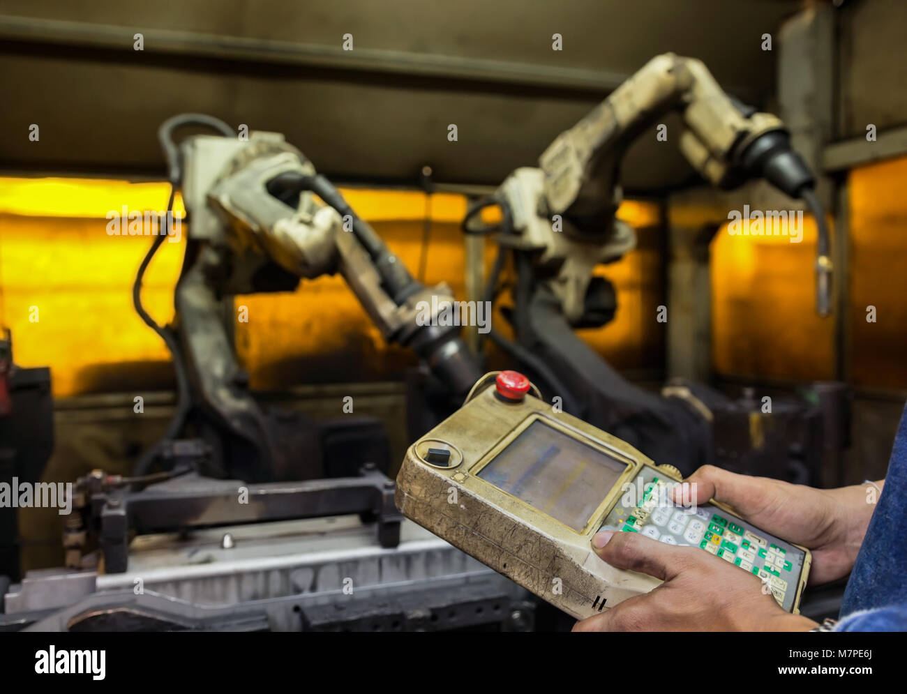 Operator is teaching robot for new program Stock Photo - Alamy