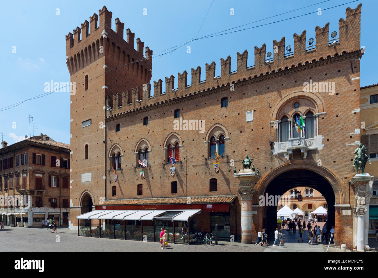 Ferrara, Italy - June 17, 2017: People walking at the Ferrara Town Hall ...