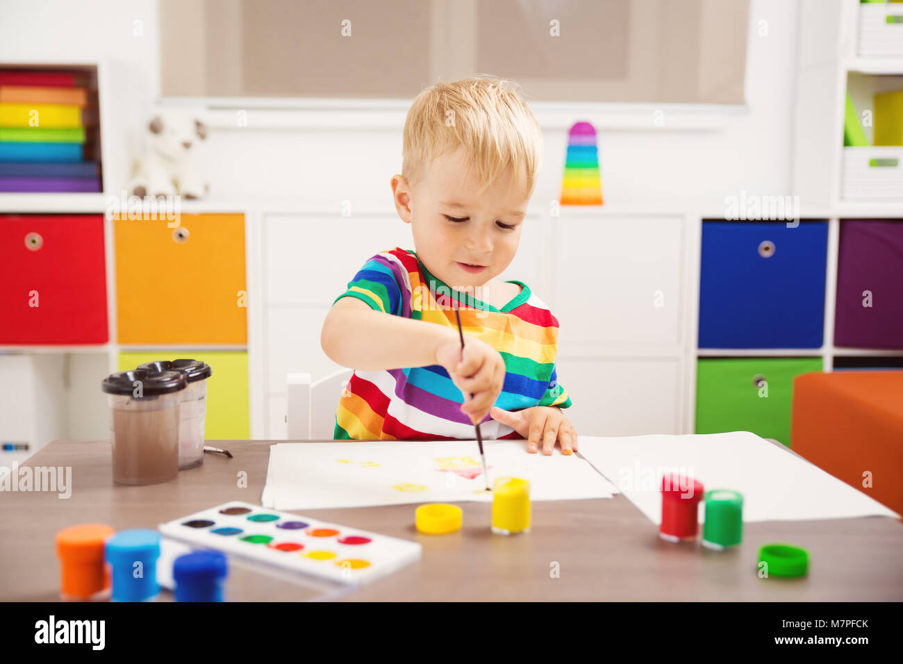Little child drawing on the paper Stock Photo - Alamy