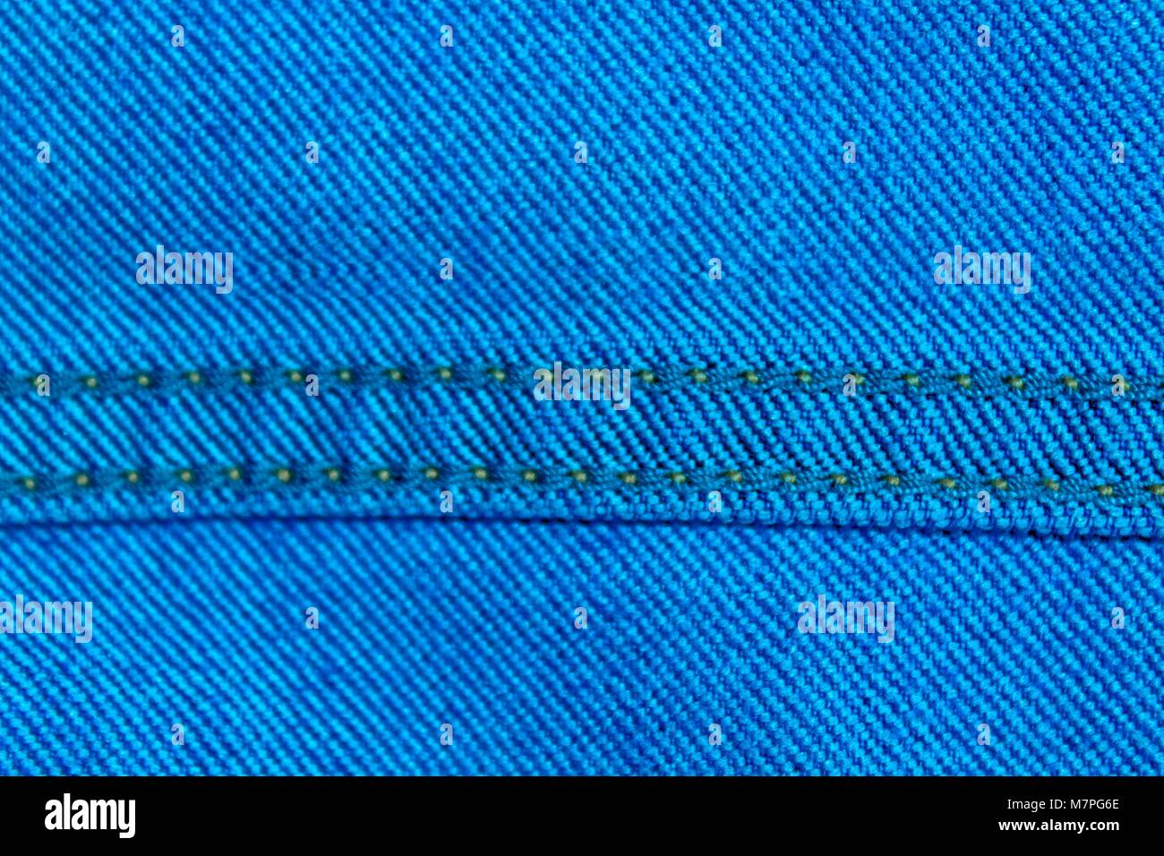 Blue Denim texture with beige seam for jeans background Stock Photo - Alamy