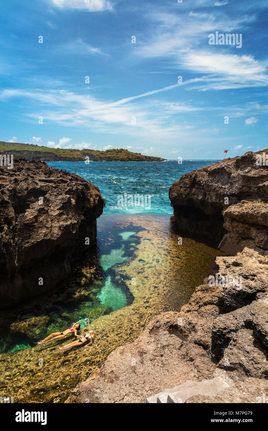 Swimming in the amazing natural infinity pool of Nusa Penida called ...