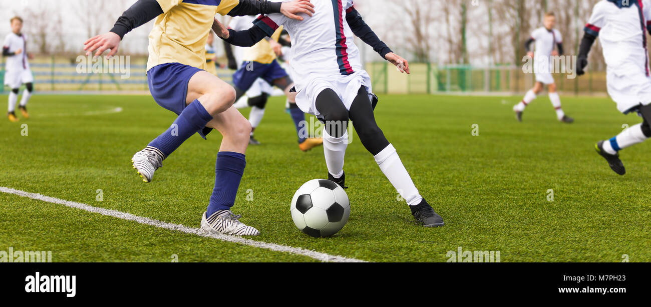 Child playing football in stadium hi-res stock photography and images ...