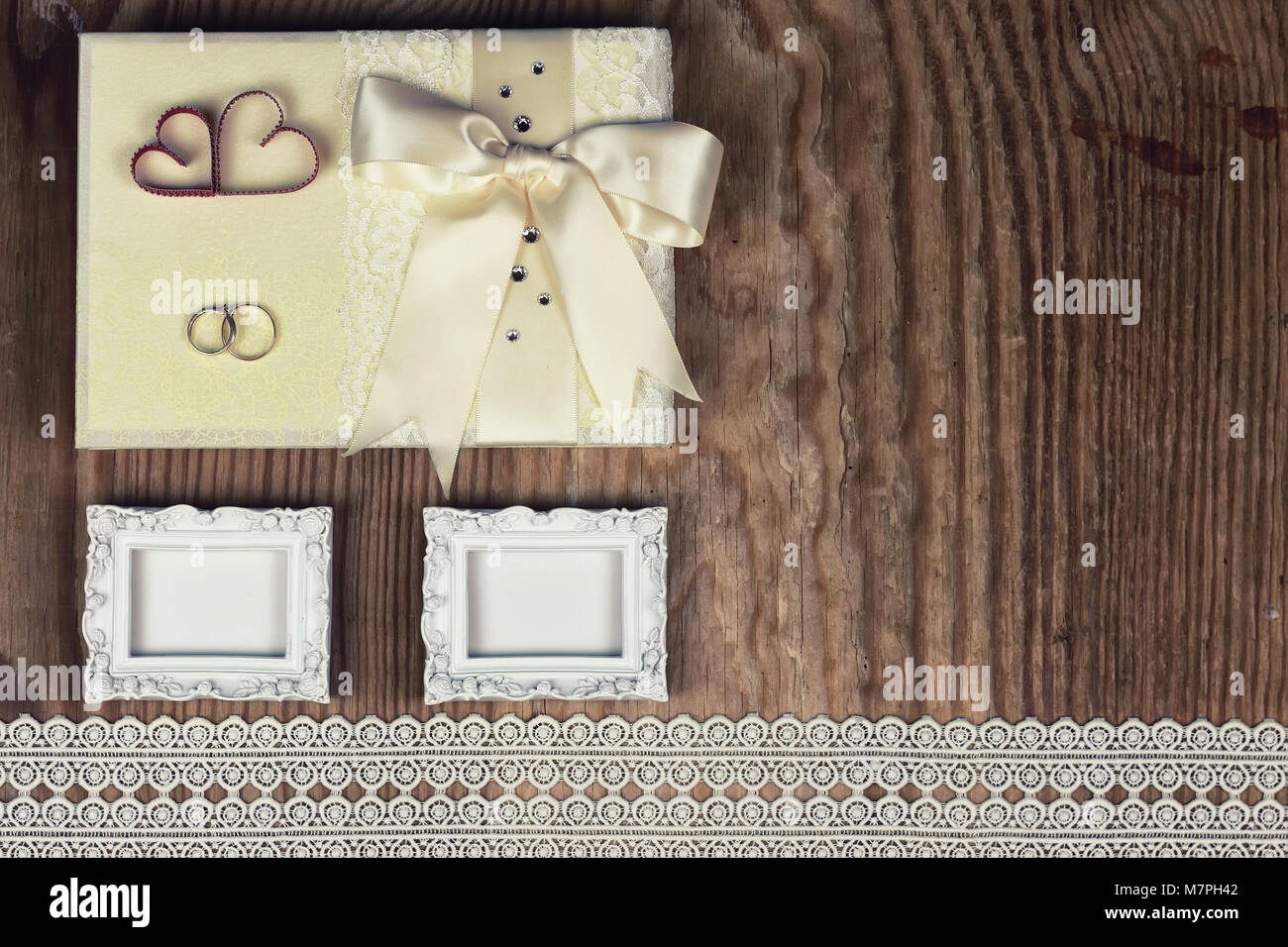 wedding ring invitation wood background Stock Photo - Alamy