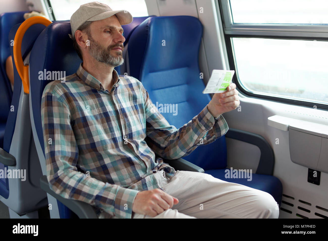 Man holding tickets hi-res stock photography and images - Alamy