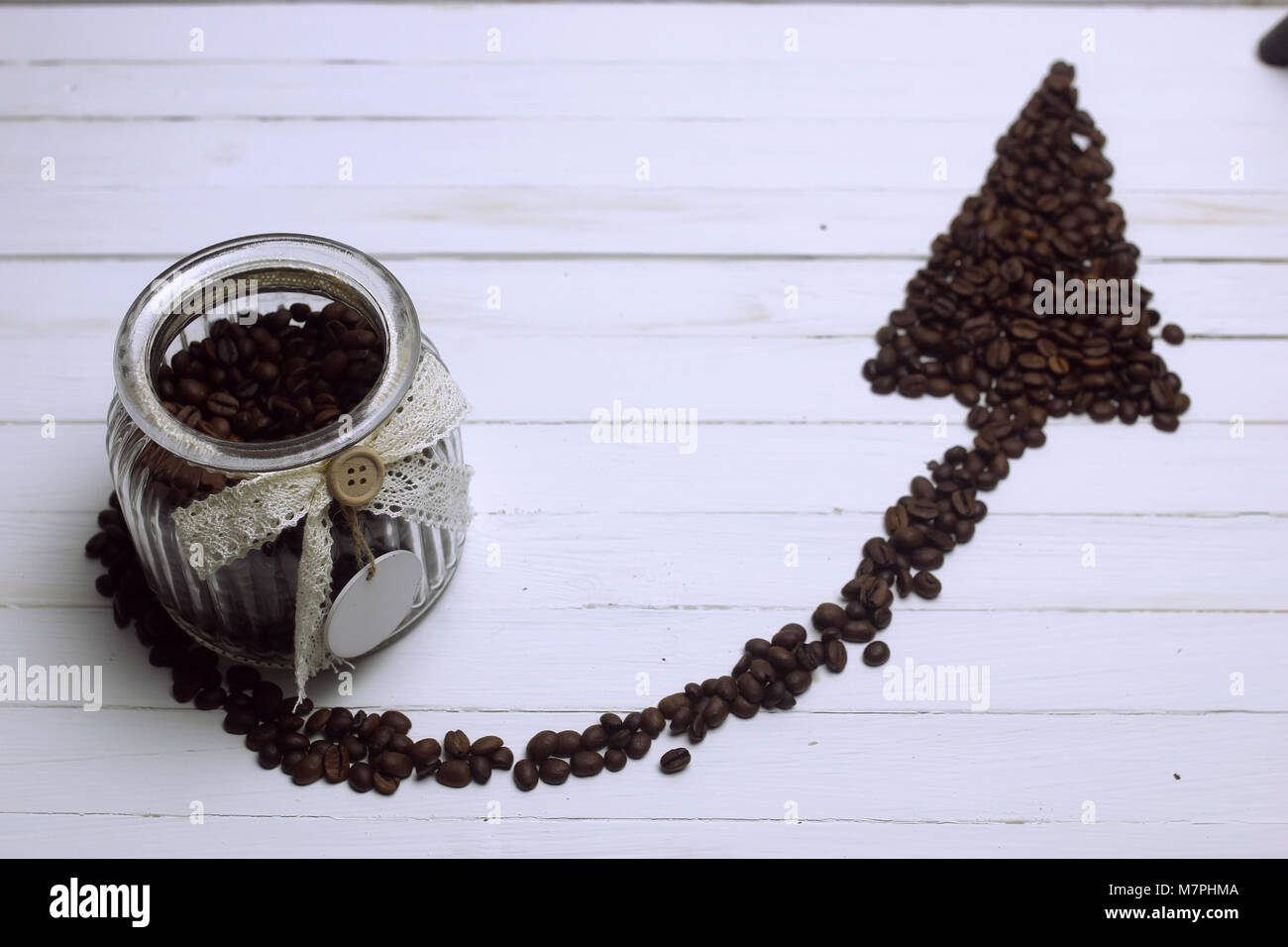 coffee bean arrow Stock Photo - Alamy