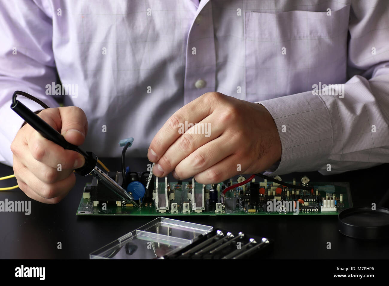 chip soldering man hands Stock Photo - Alamy