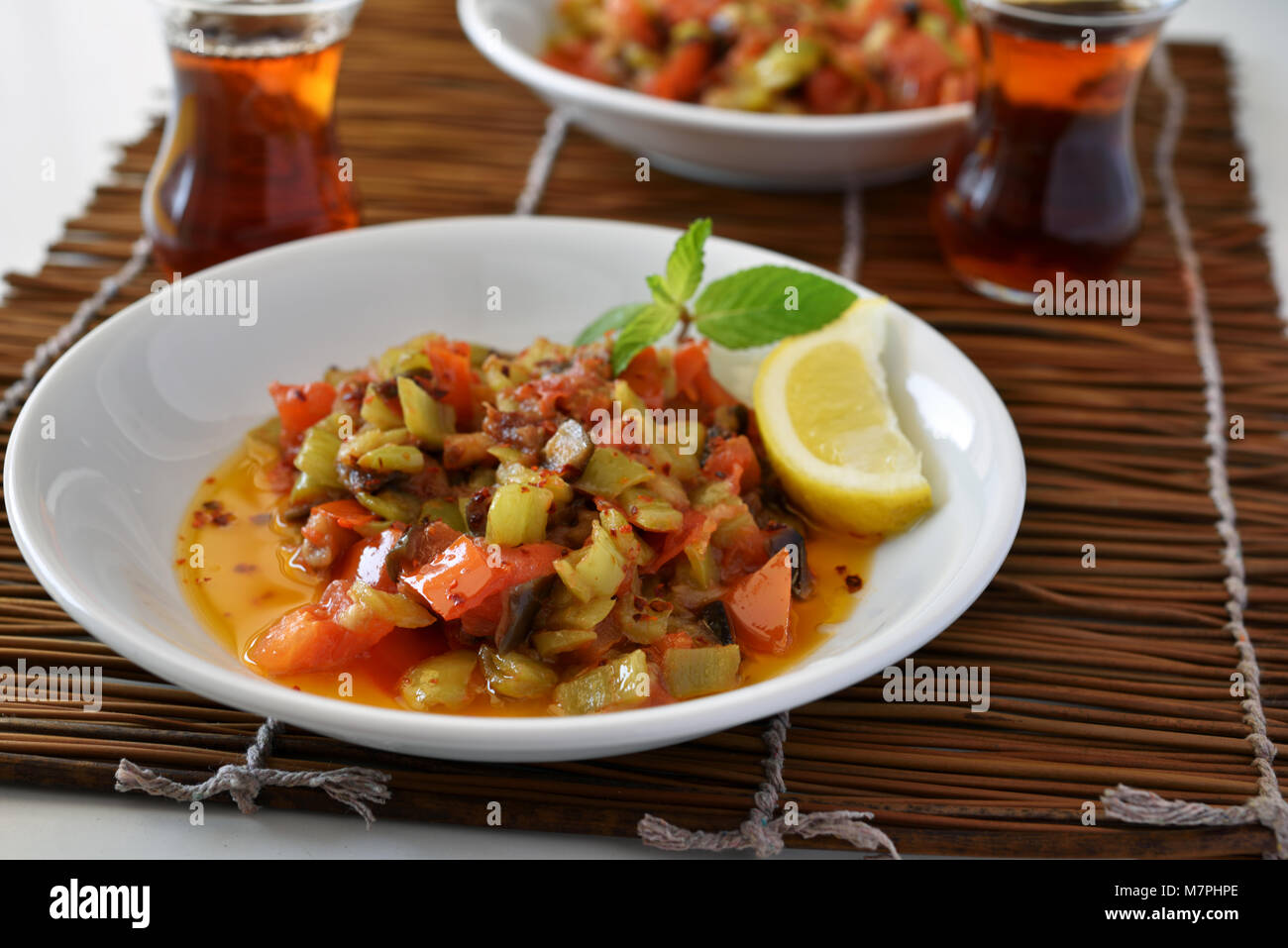 Turkish vegetable saute with pepper, eggplant, and tomato Stock Photo ...