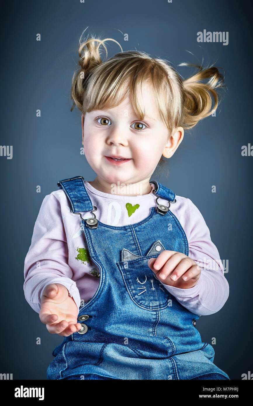 happy little female kid portrait studio shot Stock Photo - Alamy
