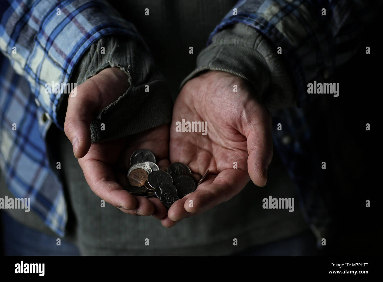 homeless man hand help Stock Photo - Alamy
