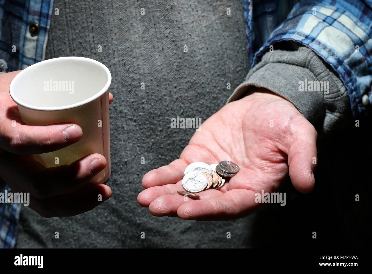homeless man hand help Stock Photo - Alamy