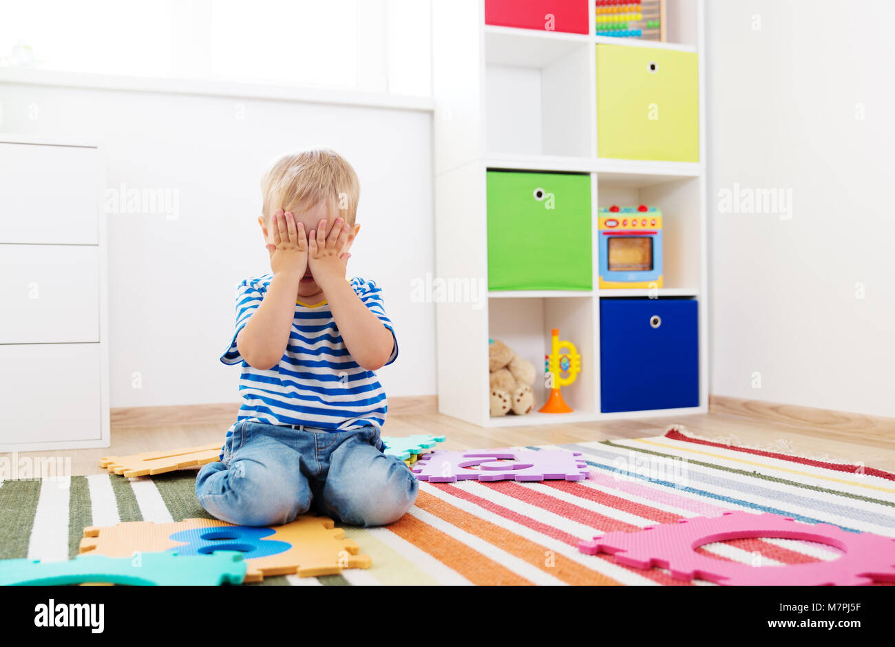 Little child playing with numbers Stock Photo - Alamy