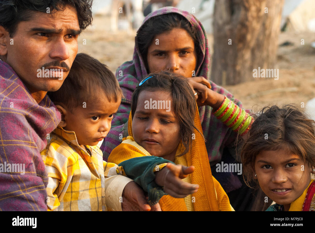 Young family visiting the annual Camel Fair at Pushkar, Rajasthan ...