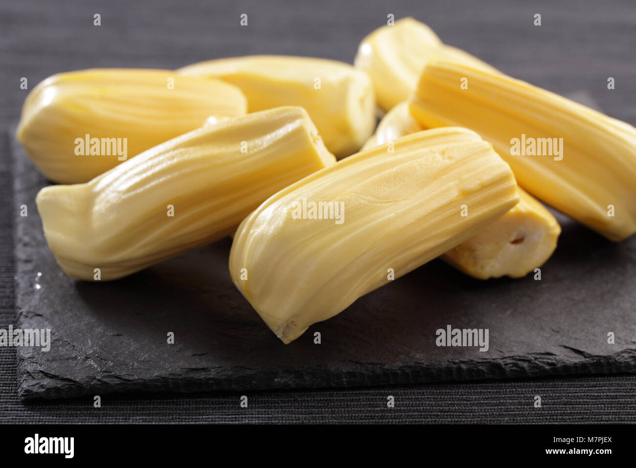 Jackfruit flesh on a kitchen table Stock Photo - Alamy