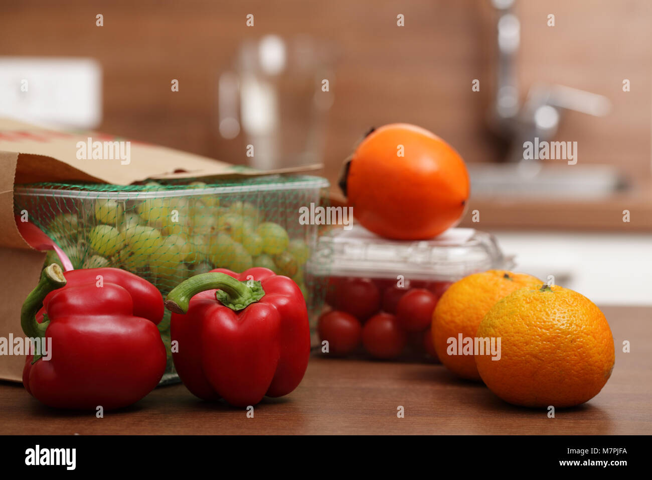 Fruits and vegetables on a kitchen table Stock Photo - Alamy