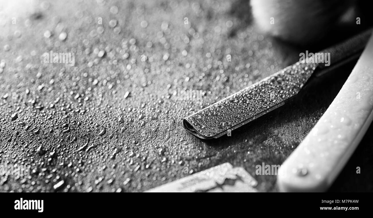 A dangerous razor and a metal blade on the table. Men's shaving Stock ...