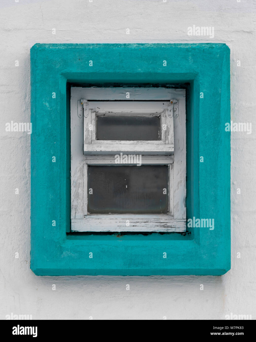 Simple wooden window with thick turquoise framing Stock Photo - Alamy