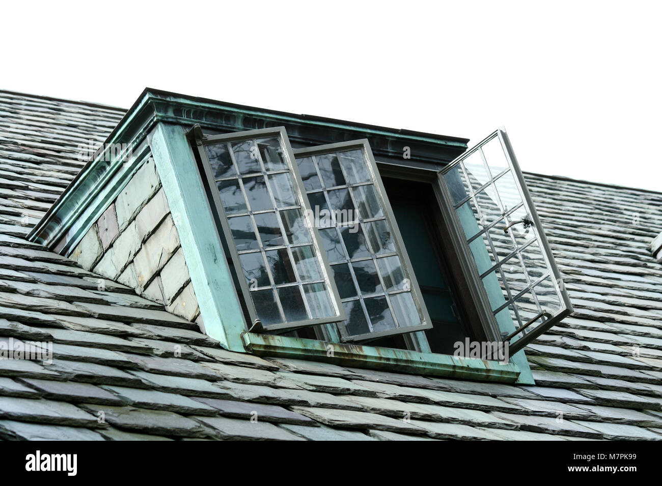 a old window on a slate roof Stock Photo - Alamy