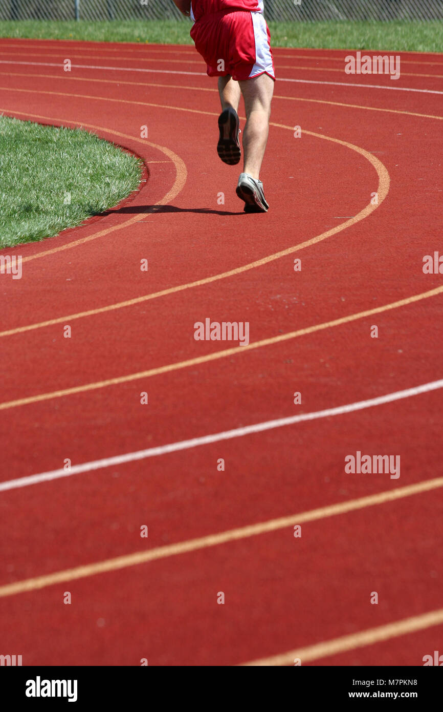 Runners running in a track race Stock Photo - Alamy
