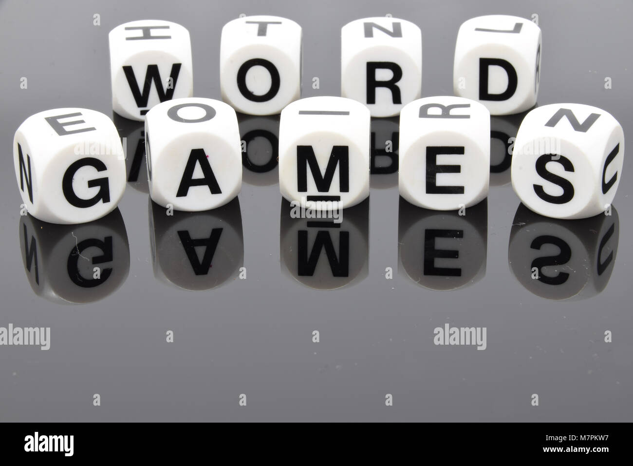 The phrase WORD GAMES spelt out in letter dice Stock Photo - Alamy