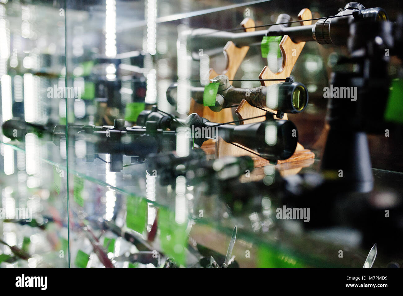 Different optical sights on shelves store weapons on shop center Stock ...