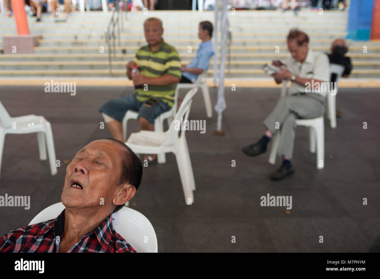 Older man sleeping outside hi-res stock photography and images - Alamy