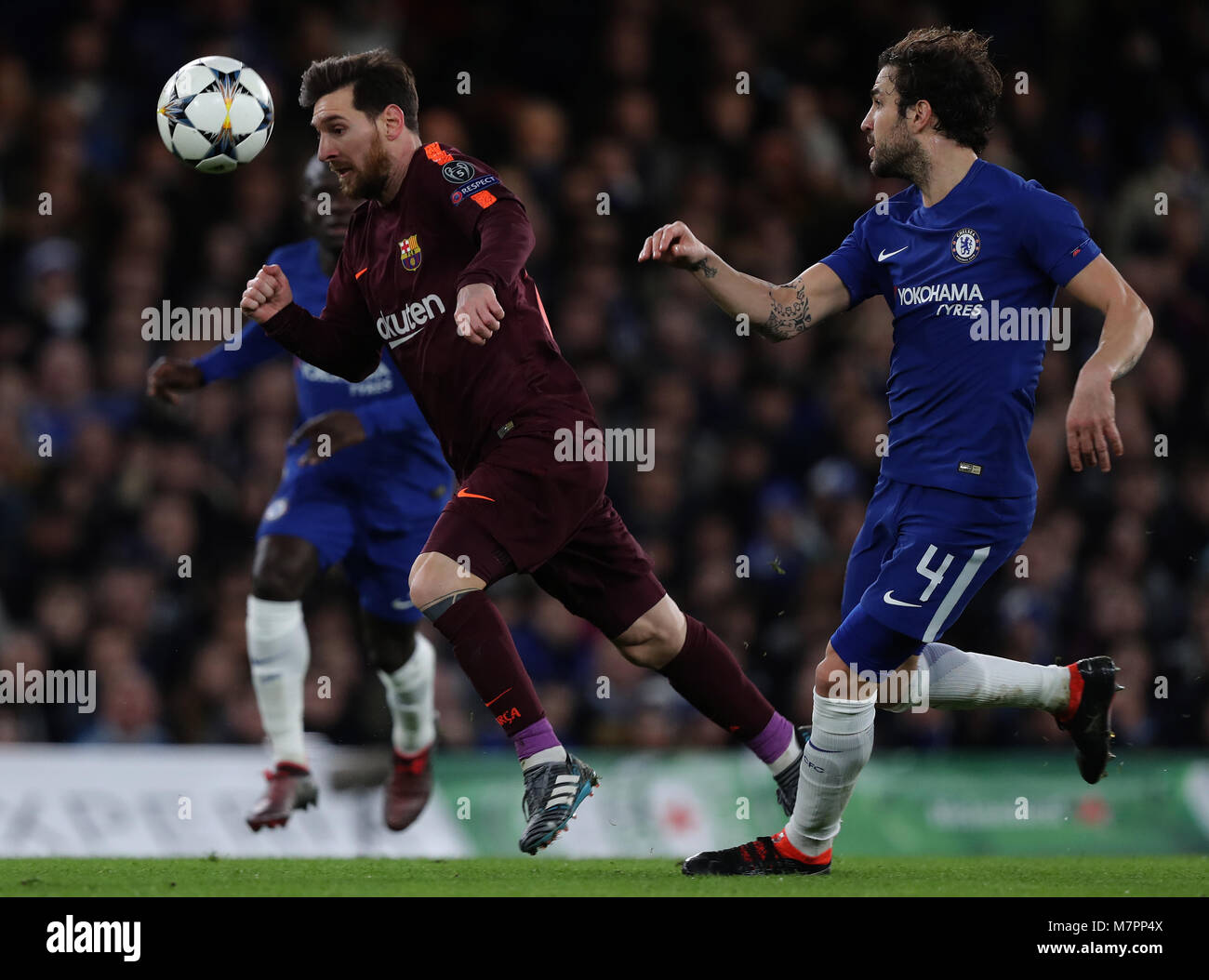 LONDON, ENGLAND - FEBRUARY 20: Lionel Messi of Barcelona and Cesc ...