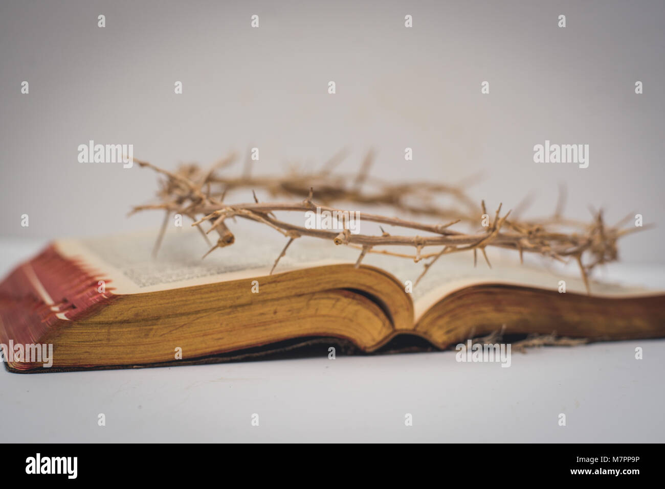A crown of thorns laying on a Bible Stock Photo - Alamy