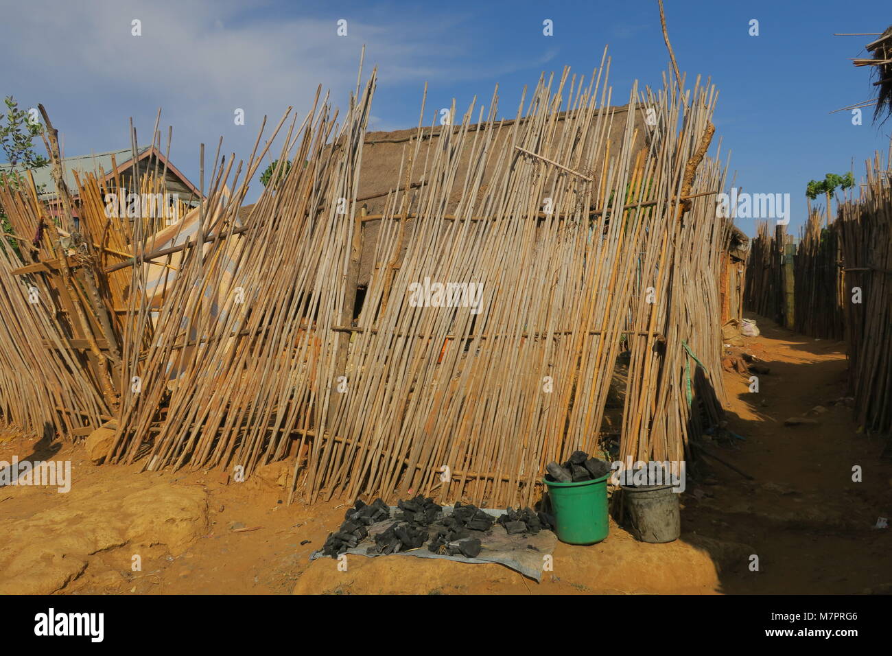 Poverty in Malagasy village. Small simple home on countryside of ...
