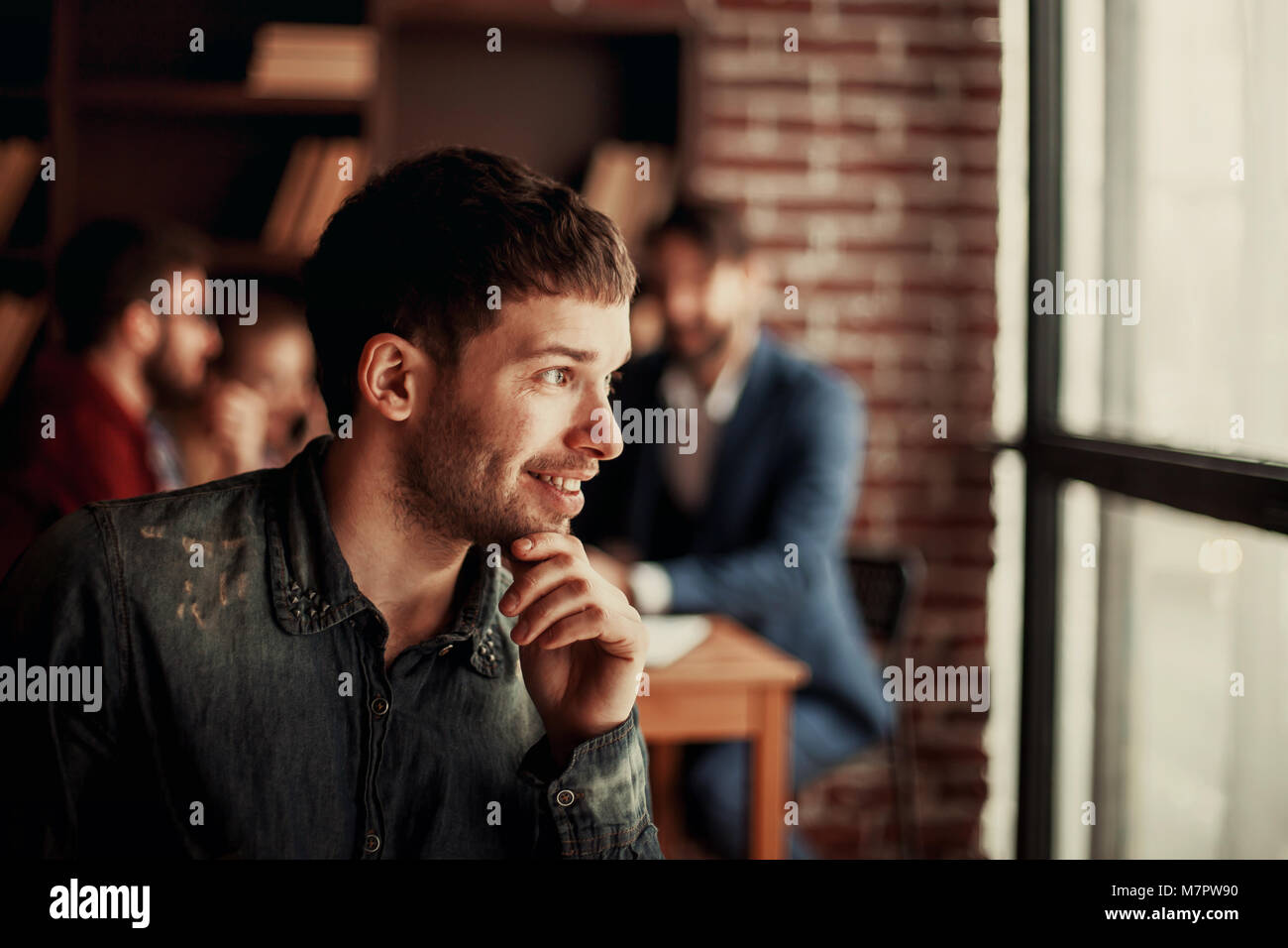 portrait of an employee of the company on the background of business ...