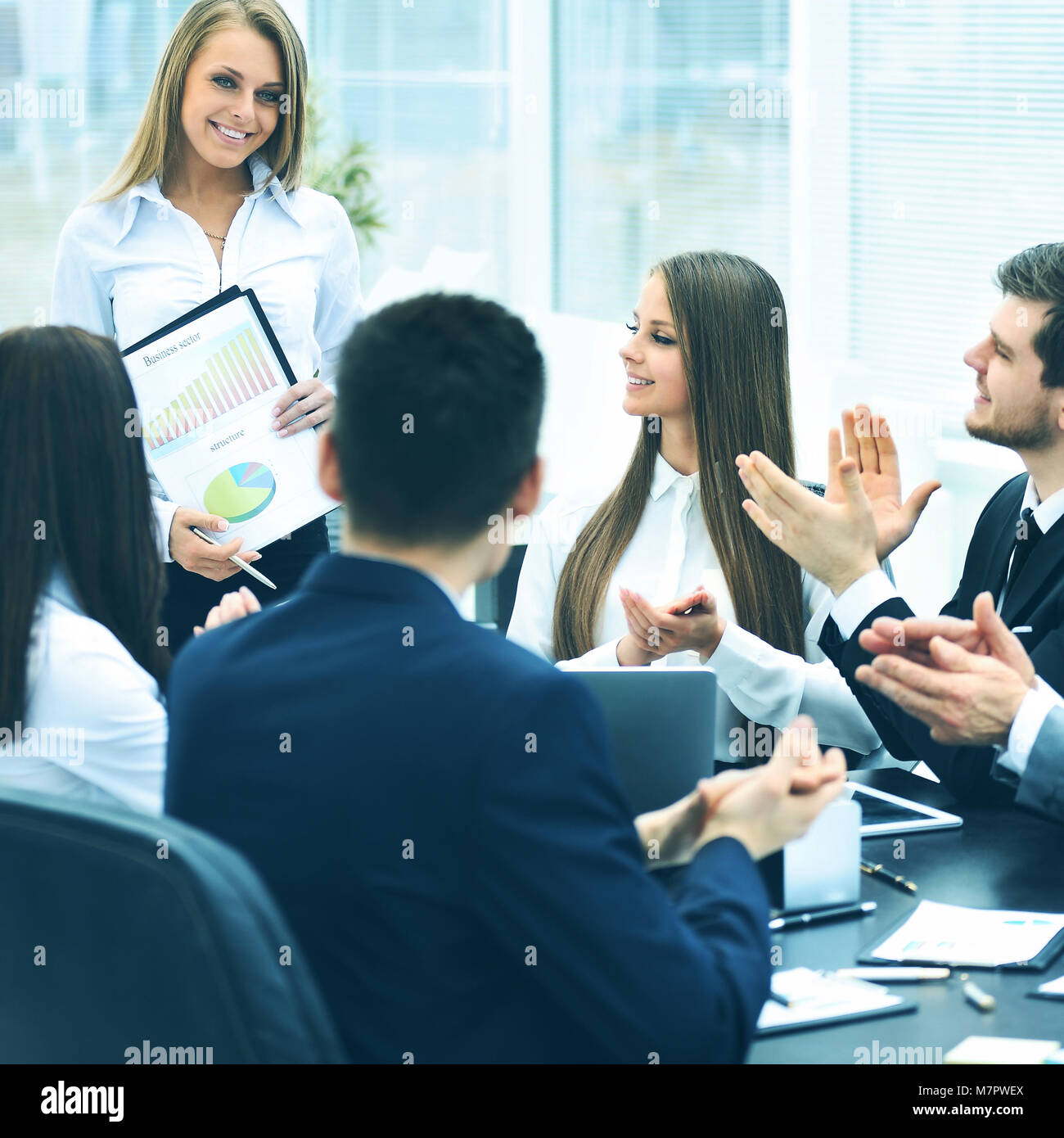 successful business presentation in the modern office, applauding the ...