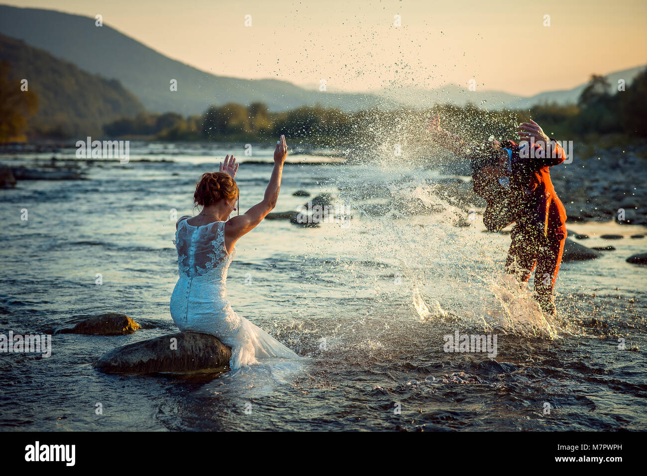 Funny family having fun splashing hi-res stock photography and images ...