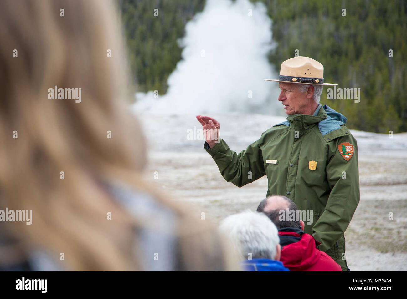 Interpretive program at Old Faithful Ranger at Old Faithful talking ...
