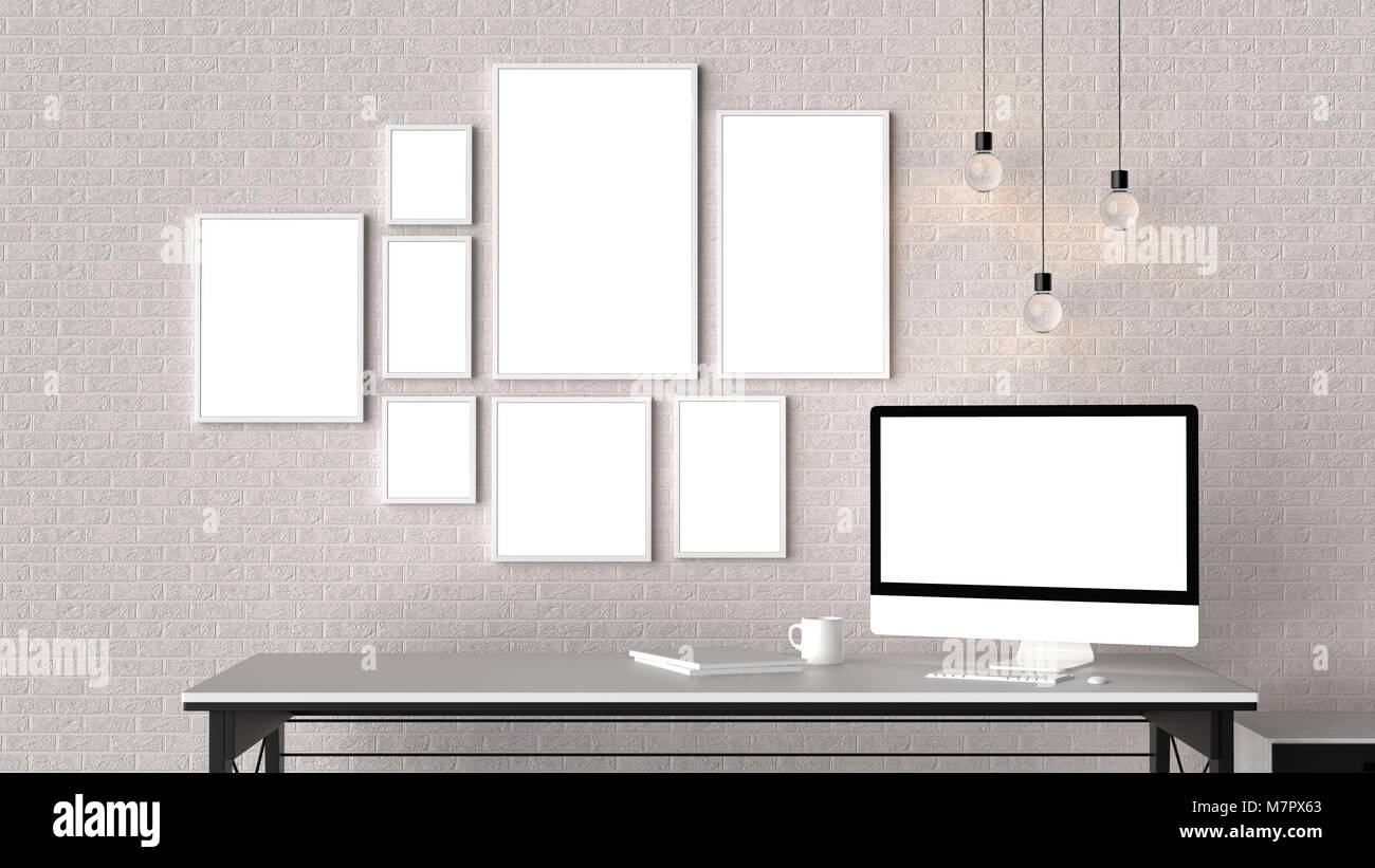 Modern workspace with isolated empty frames on brick wall and isolated ...