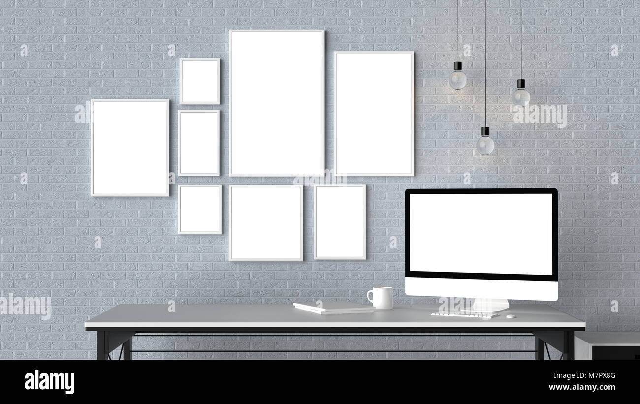 Modern workspace with isolated empty frames on brick wall and isolated ...