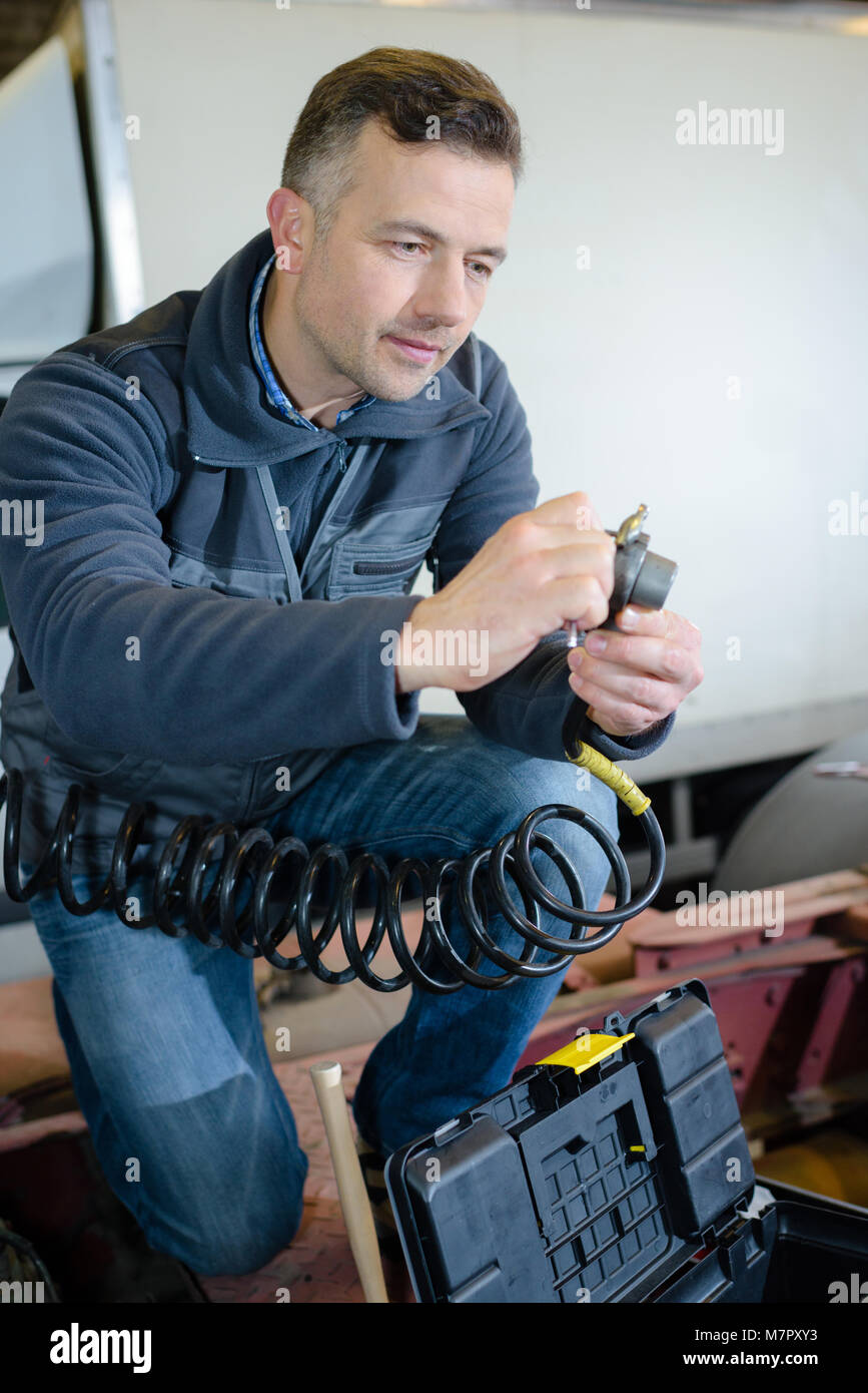 portrait of male mechanic at work in the garage Stock Photo - Alamy
