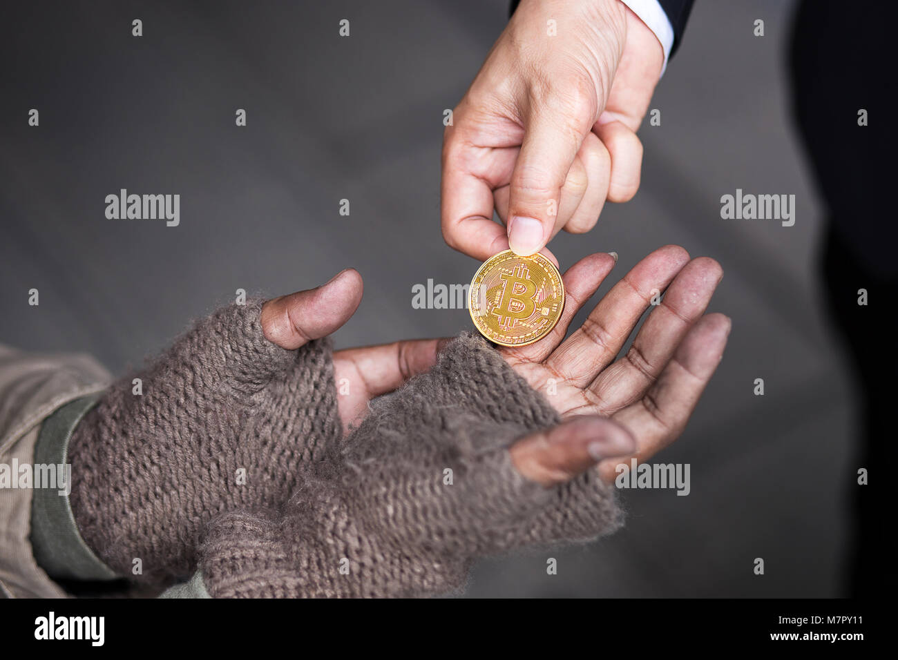 business man give, donate, his gold bitcoin to homeless man in downtown ...