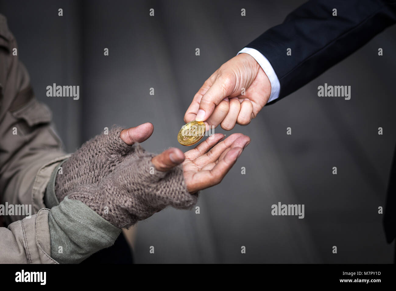 business man give, donate, his gold bitcoin to homeless man in downtown ...