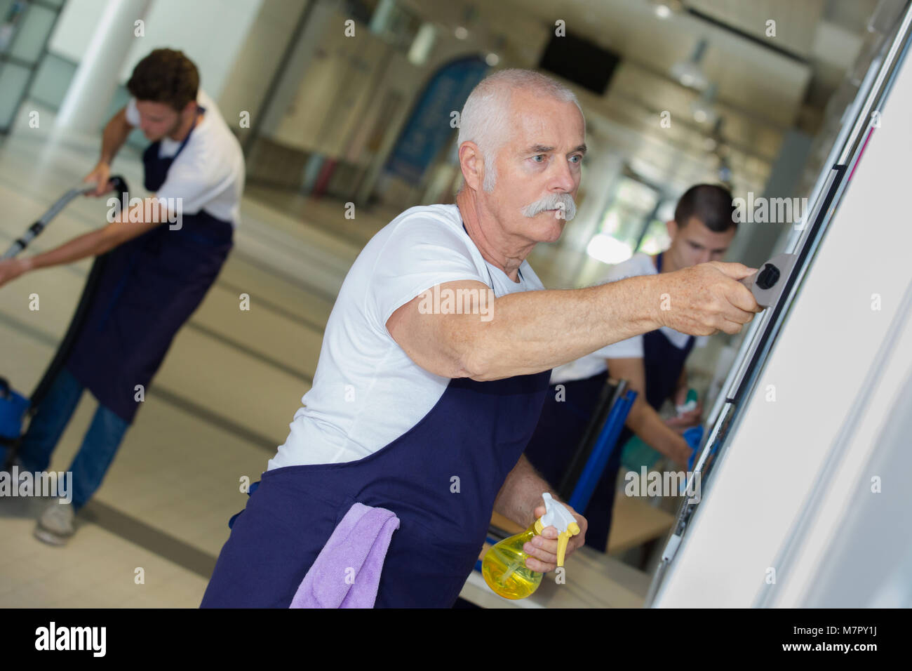 senior janitor at work Stock Photo - Alamy