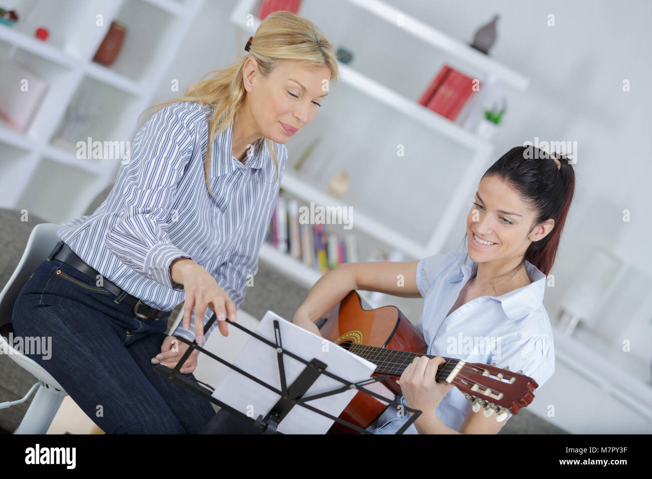 the guitar tutorial session Stock Photo - Alamy