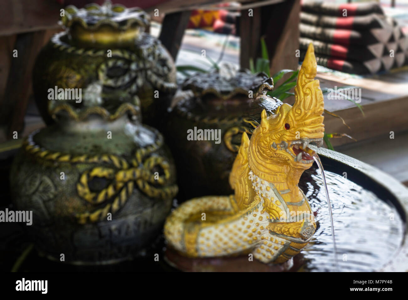 Mini Naga sculpture in garden bowl, stock photo Stock Photo - Alamy