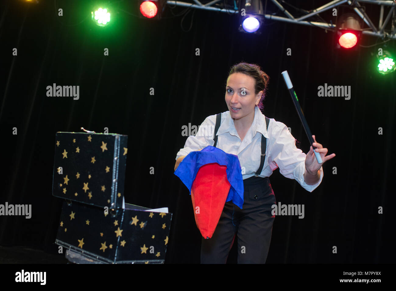 Woman performing magic trick hi-res stock photography and images - Alamy