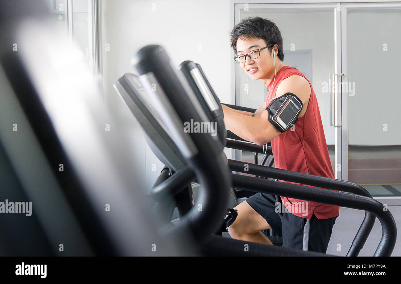 Asian man running on treadmill on gym hi-res stock photography and ...