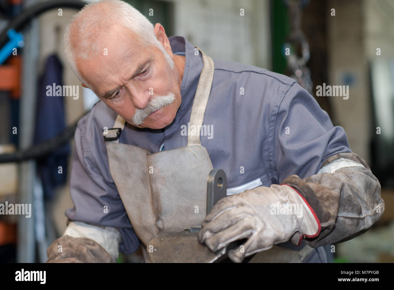 Senior metalworker at work Stock Photo - Alamy