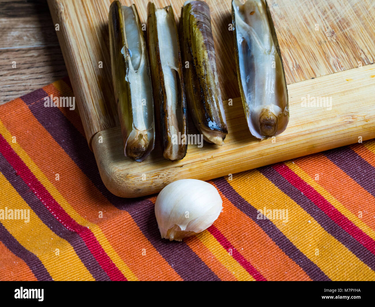 Raw razor clams Stock Photo - Alamy
