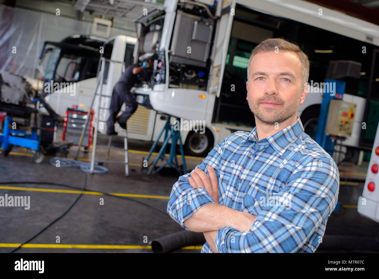 Portrait of man in garage Stock Photo - Alamy
