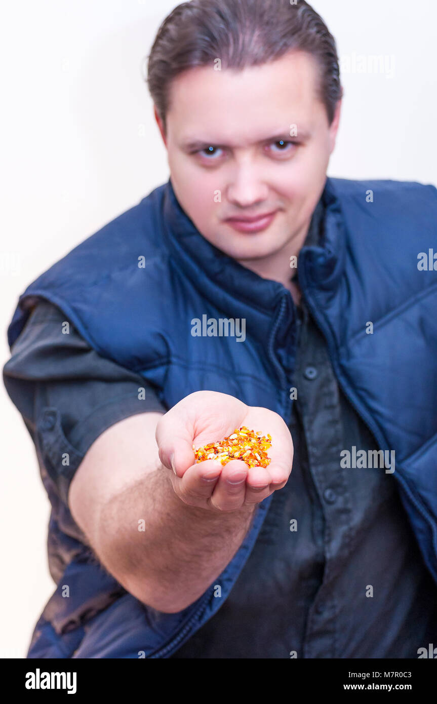 Portrait of young Caucasian Ethnicity man showing offering fistful of ...